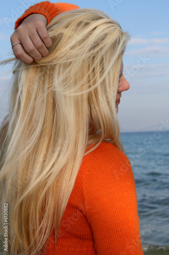 "A woman with long blonde hair turned back" Stock photo and royalty ...