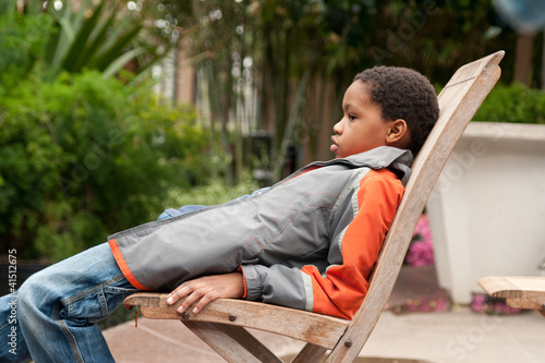 "Bored kid slouching in a chair" Stock photo and royalty-free images on ...