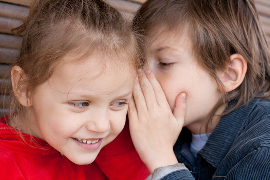 Children Telling A Secret