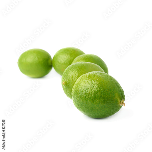 "Five limes fruits composition isolated over the white background ...