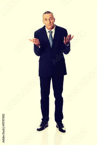 "Full length businessman making undecided gesture" Stock photo and ...