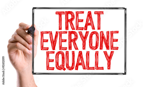 "Hand with marker writing: Treat Everyone Equally" Stock photo and ...