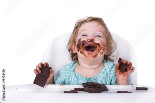 "Adorable kid eating chocolate with face covered in chocolate" Stock ...