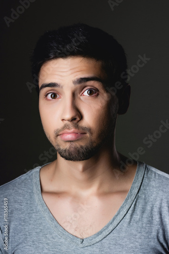 "Portrait of a normal boy over grey background / Attractive young ...