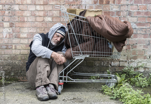 "Homeless man out on the streets with his belongings in a trolley ...