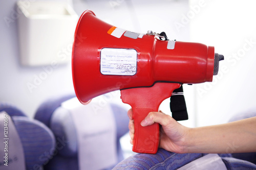 "hand holding cabin emergency megaphone, aircraft emergency equipment ...