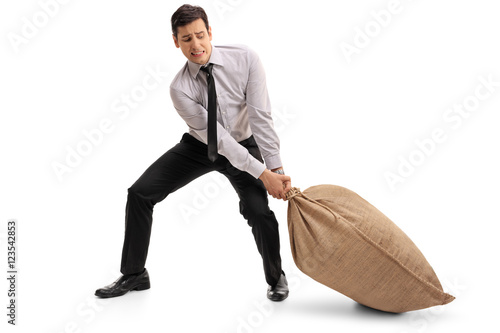 "Young businessman pulling a burlap sack" Stockfotos und lizenzfreie ...