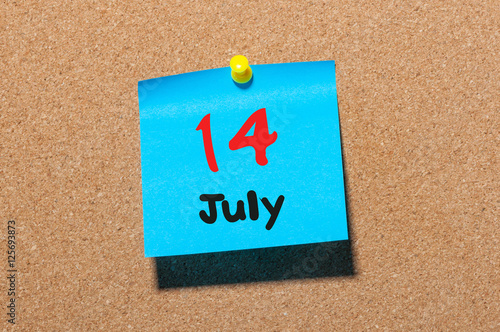 "July 14th. Day 14 of month, color sticker calendar on notice board ...