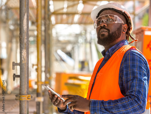 "Attractive African american engineer at work on construction site ...