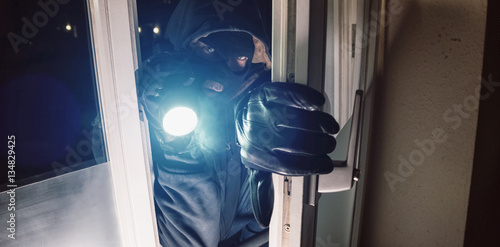 "house robbery - burglar with flashlight at night" Stockfotos und ...