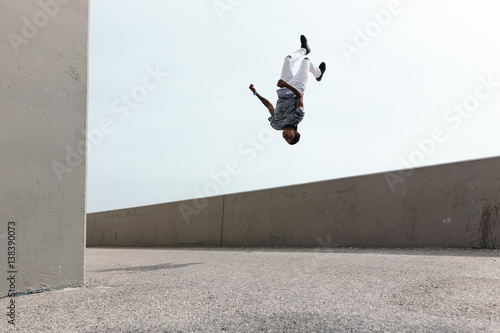 "Man upside down in mid air doing backflip" Stock photo and royalty ...