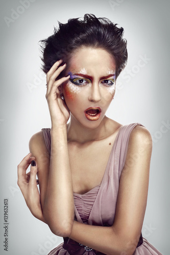 "Beauty portrait of angry screaming woman with creative makeup. Posing ...