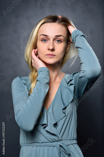 "Portrait of a blond girl, hand holding hair" Stock photo and royalty ...