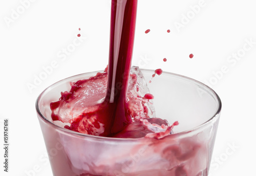 "Fresh red juice being poured into glass" Stock photo and royalty-free ...