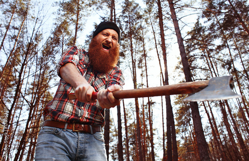"a lumberjack works with an axe in the forest" Stock photo and royalty ...