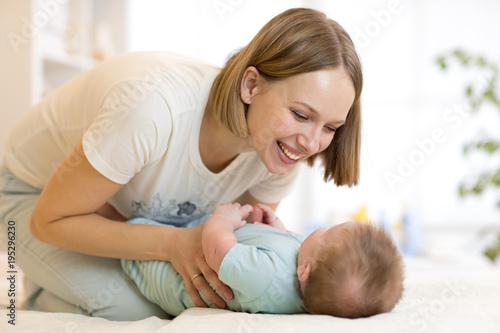 "Pretty woman looking after baby" Stock photo and royalty-free images ...