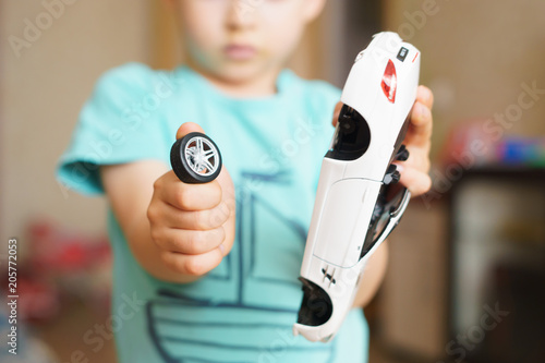 "boy broke the toy. broken wheel from the car" Stock photo and royalty ...