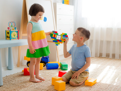Children Sharing Blocks