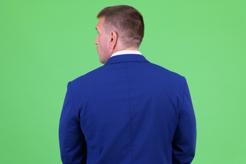 Strong Man Displaying Muscular Back on Green Screen from Pikwizard