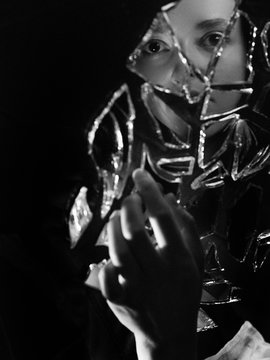 Face In Cracked Mirror