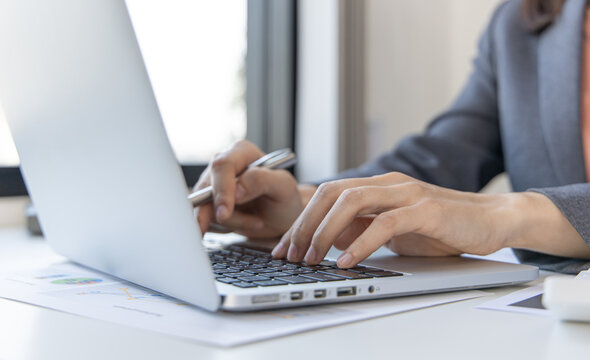 Fototapeta: Person typing on laptop keyboard, businessman working on ... Fototapeta: Person typing on laptop keyboard, businessman working on ...