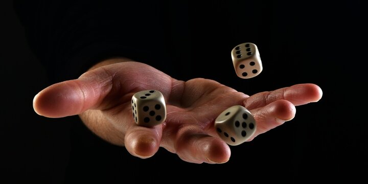 Woman Hand Rolling Dice
