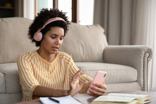 Black Teenage Student In Headphones Reading Book Images – Browse 49 ...