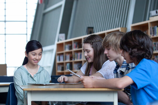 Middle School Students Studying In Class