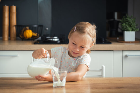 Kid Pouring Milk