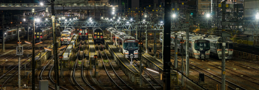 Train Tracks With Train At Night