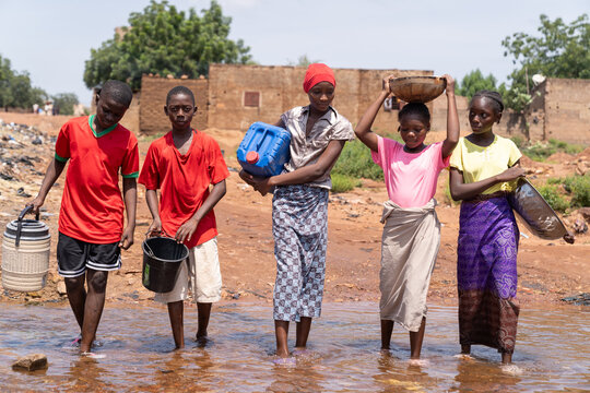 African People Carrying Water